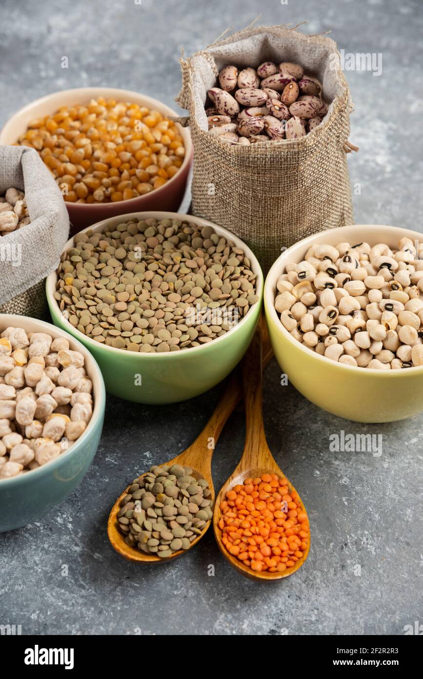 Different type of raw dry legumes composition on marble surface Stock ...