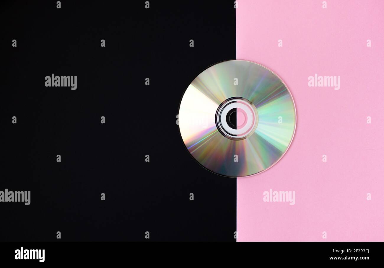 Computer-Disk on pink black background. CD and DVD background concept ...