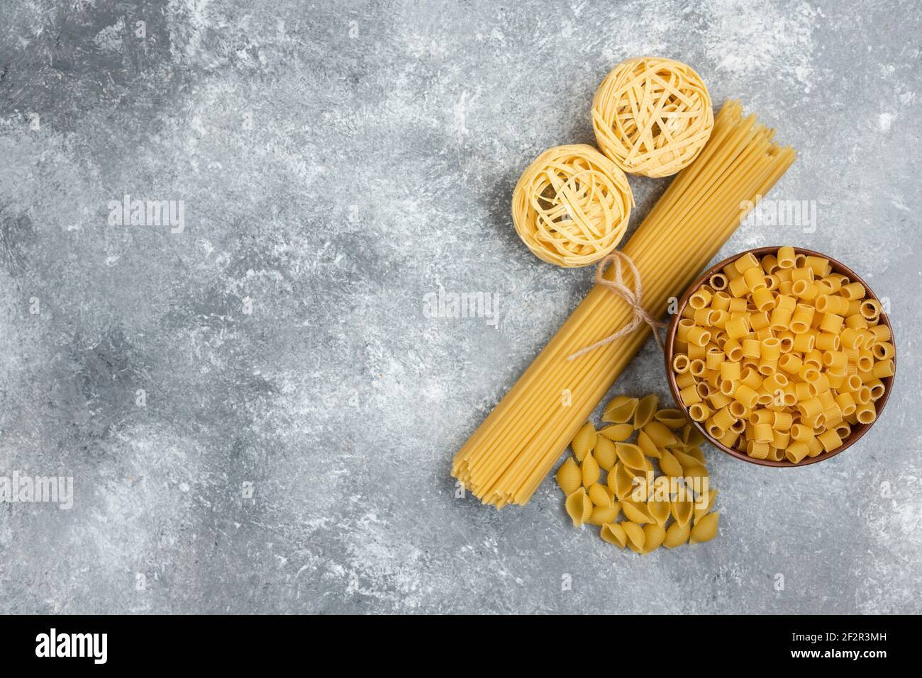 Raw pasta and spaghetti varieties on marble background Stock Photo - Alamy