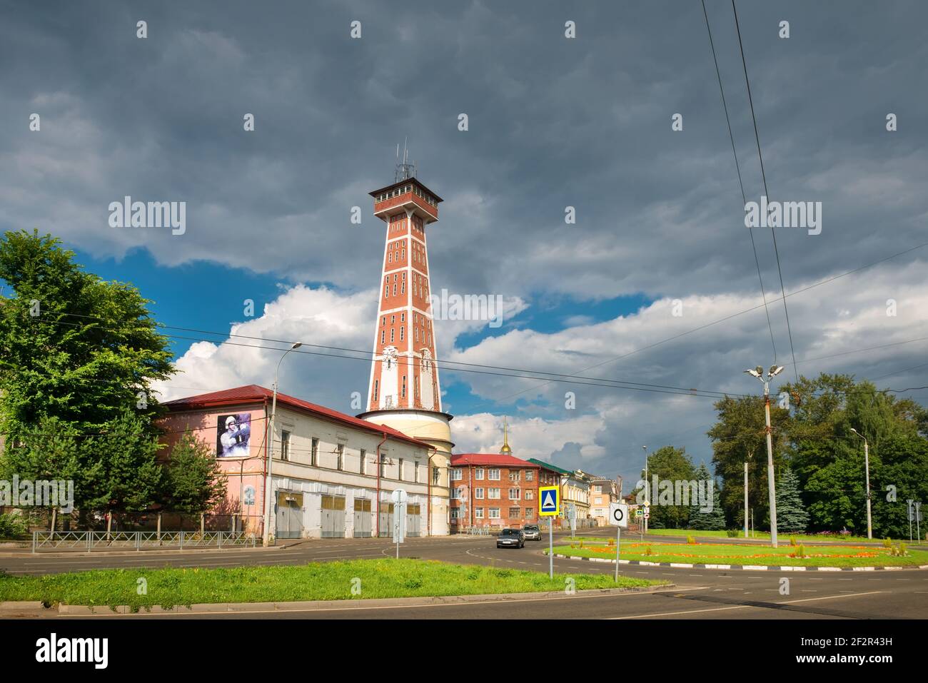 RYBINSK, RUSSIA / AUGUST 15,2020: Herzen Street, 2. Far away fire tower ...