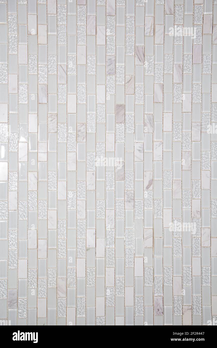 Pearl tiles, small pieces decorating the wall, front view. Background ...