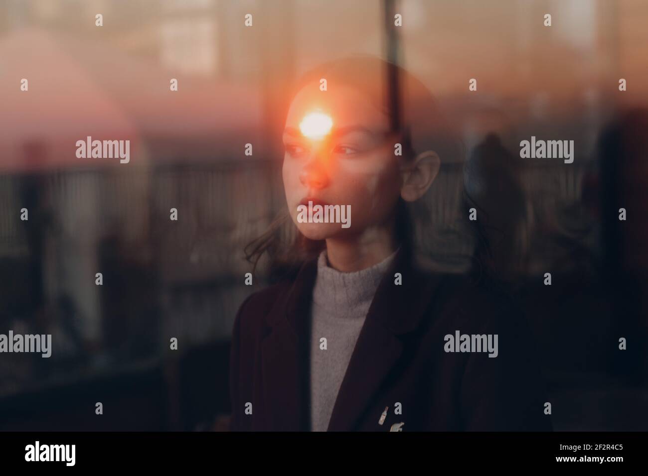 Beautiful young teenager girl portrait behind window glass Stock Photo ...