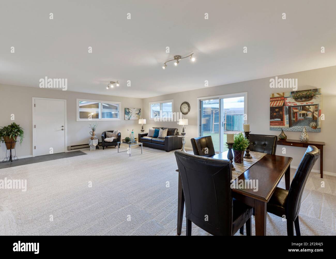 Modern residential dining room and living room interior Stock Photo - Alamy