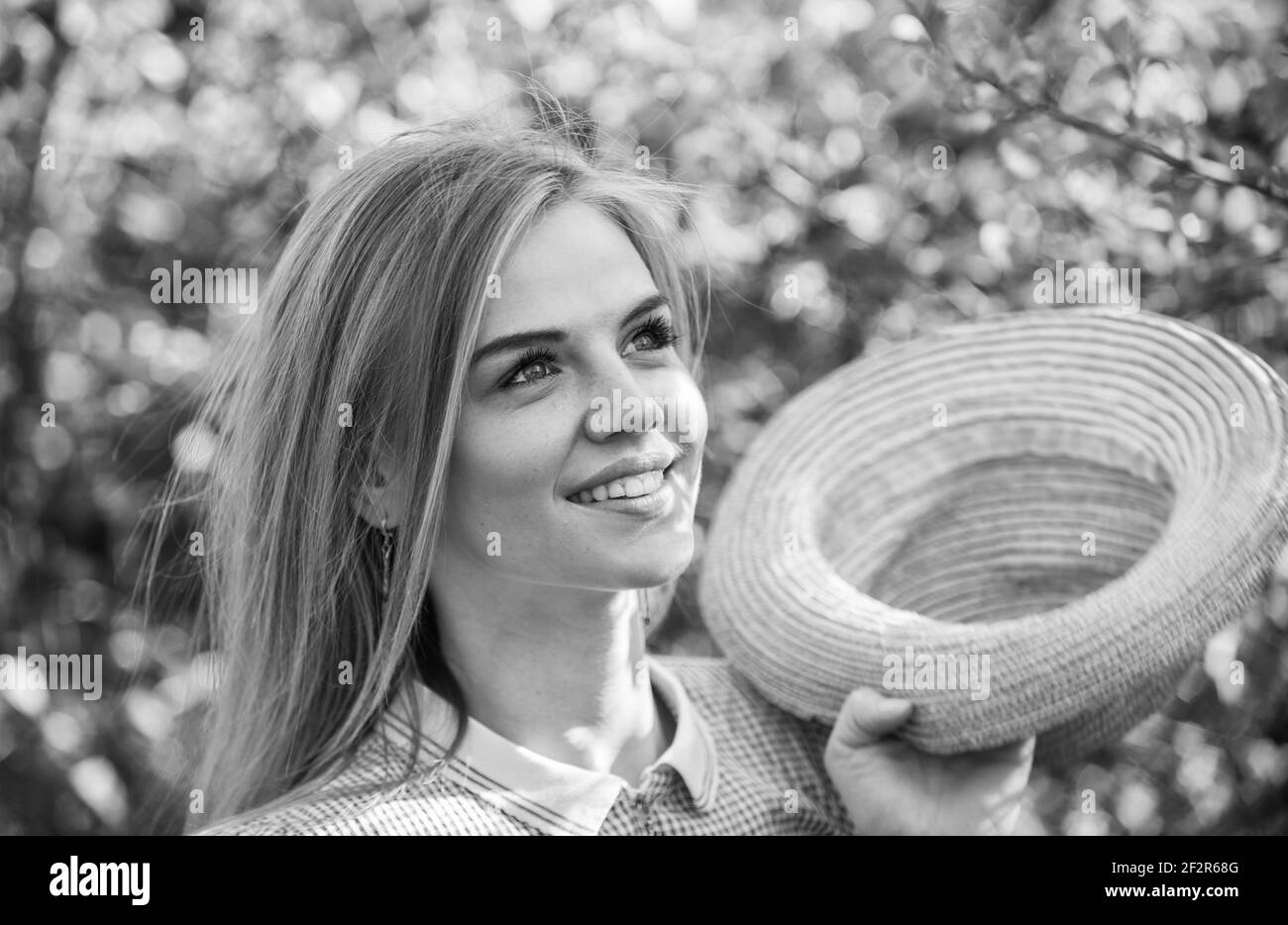 Rustic style. Romantic daydreamer hold summer hat. Rustic soul. Straw ...