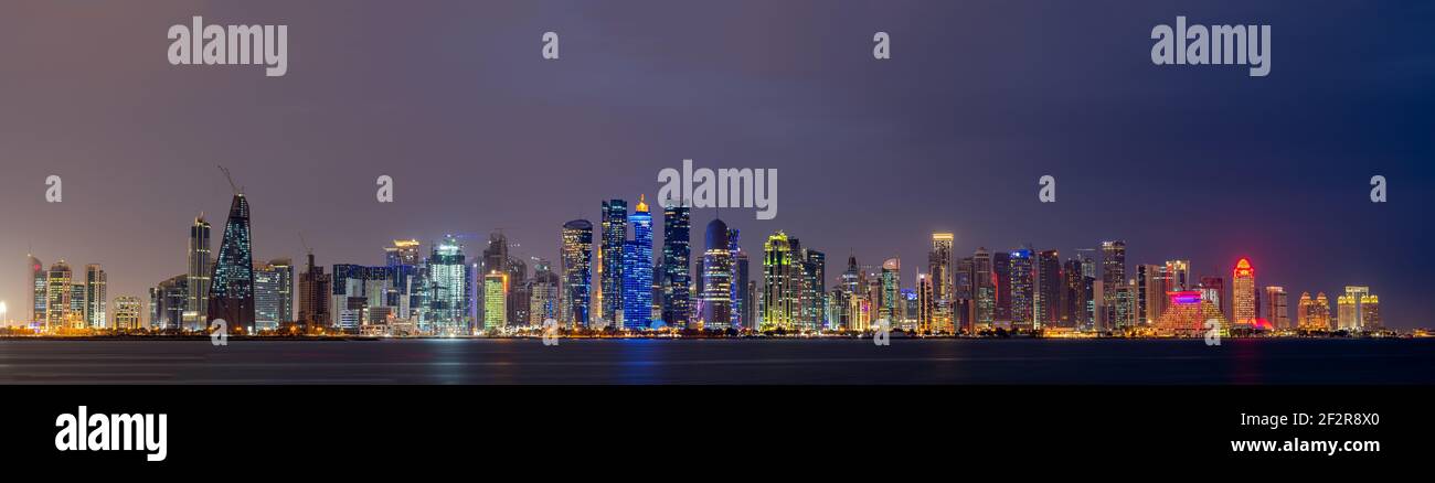 The skyline of Doha, Qatar after sunset Stock Photo - Alamy