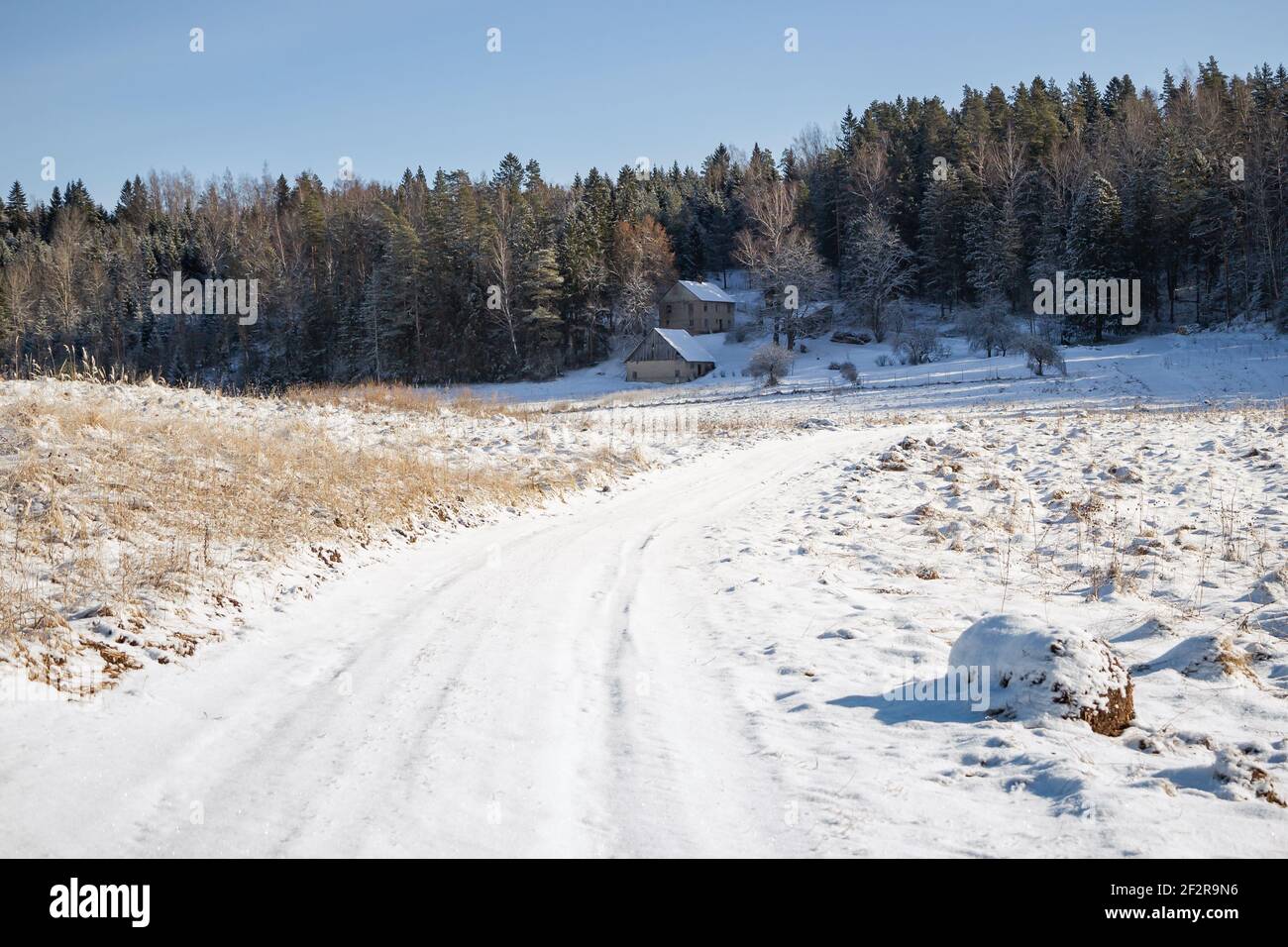 Snowy path to the abandoned house in countryside Stock Photo - Alamy