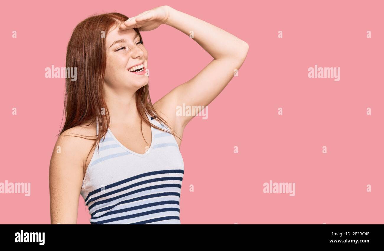 Young read head woman wearing casual clothes very happy and smiling ...