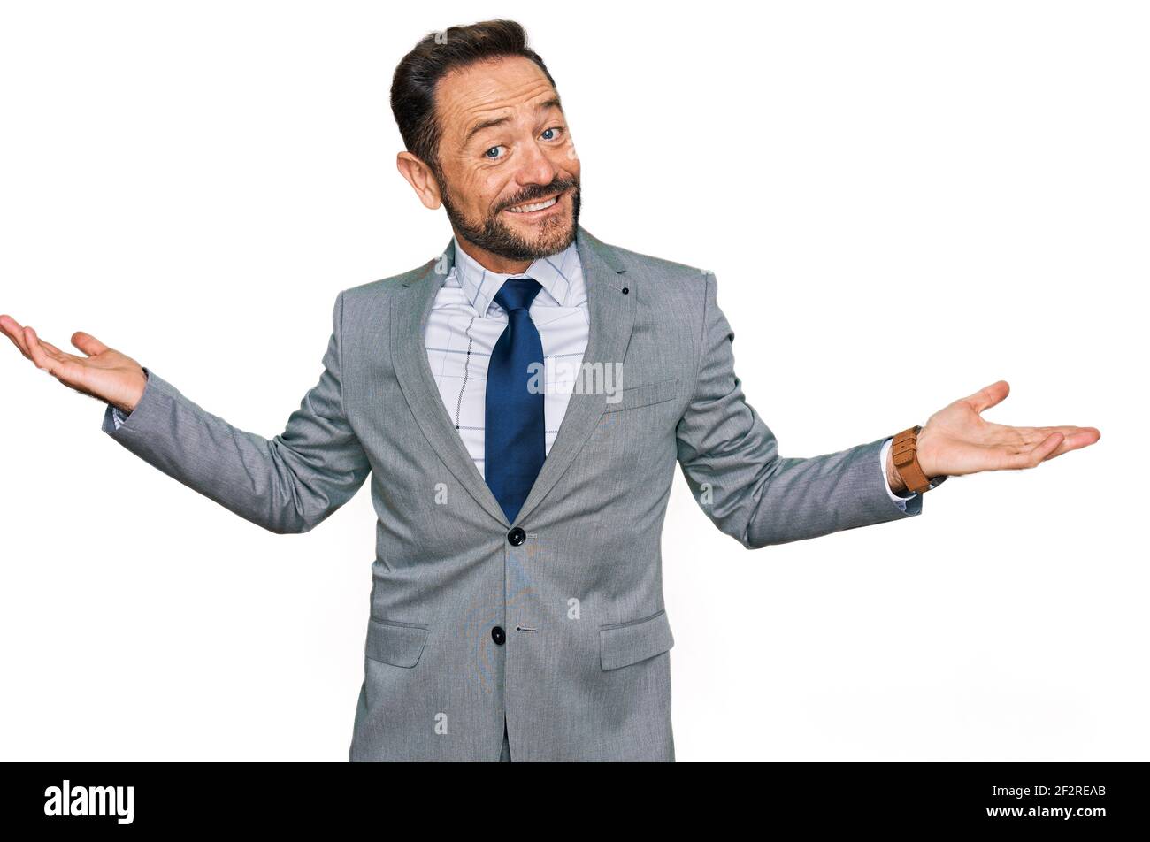 Middle age man wearing business clothes smiling showing both hands open ...