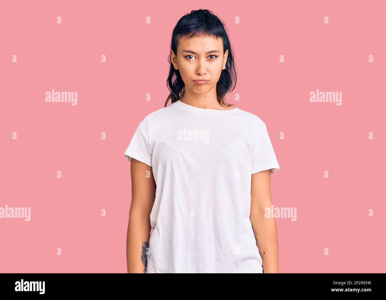 Young woman wearing casual clothes depressed and worry for distress ...