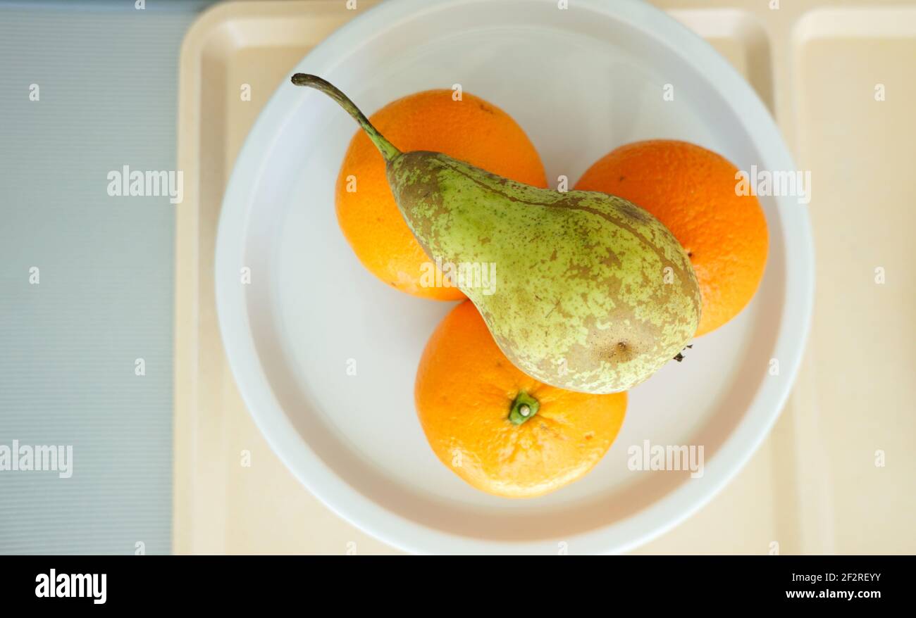 Fresh fruit in the hospital photographed on the tray with natural light ...