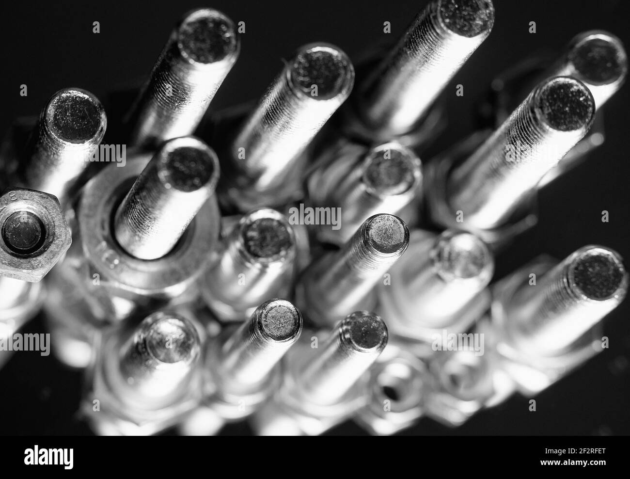 Bolts and nuts on a mirror background Stock Photo - Alamy