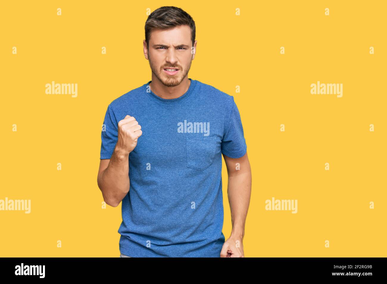 Handsome caucasian man wearing casual clothes angry and mad raising ...