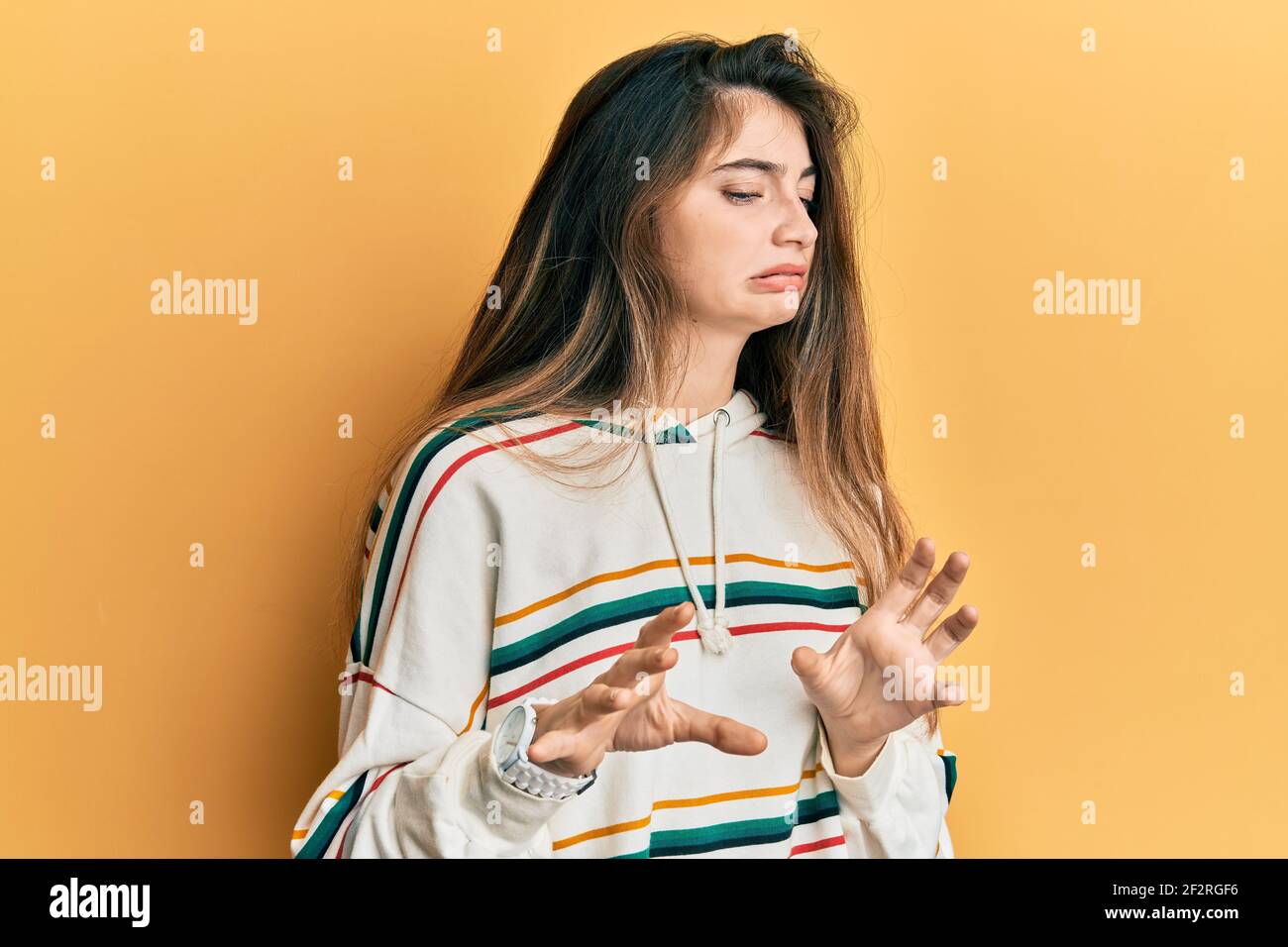 Young caucasian woman wearing casual clothes disgusted expression ...