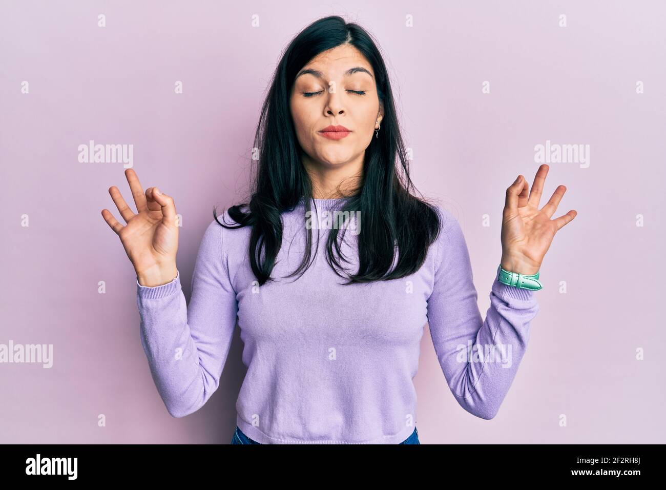 Young hispanic woman wearing casual clothes relaxed and smiling with ...
