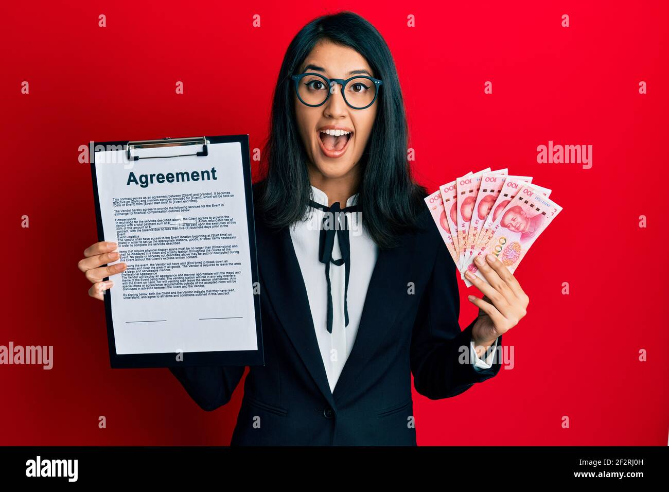 Beautiful asian young business woman holding agreement document and 100 ...