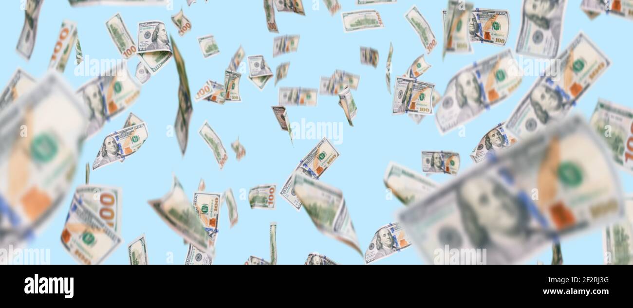 Money rain of 100 american dollars bank notes over blue isolated ...