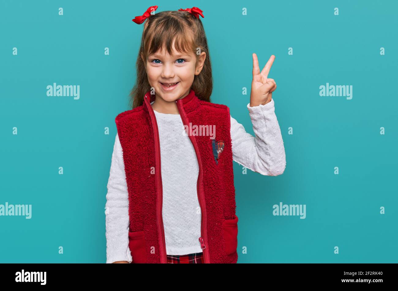 Little caucasian girl kid wearing casual clothes smiling with happy ...