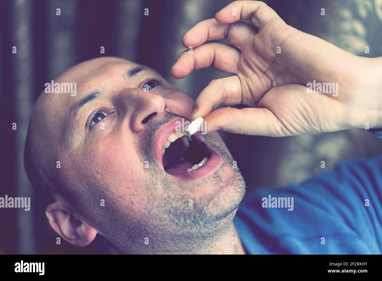 Young men taking medical pill hi-res stock photography and images - Alamy