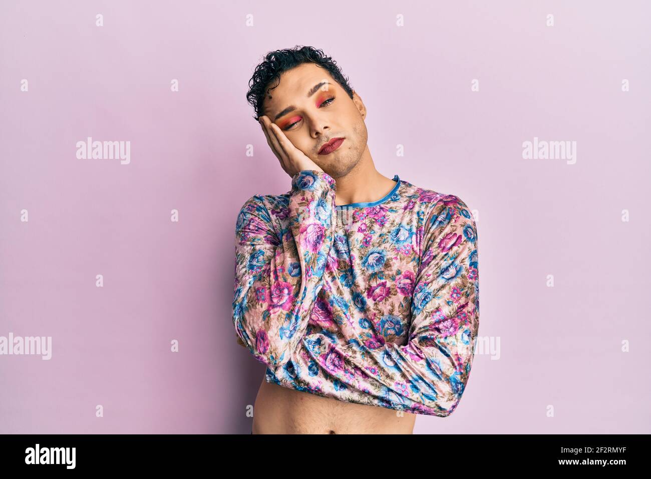 Handsome man wearing make up wearing fashion clothes thinking looking ...