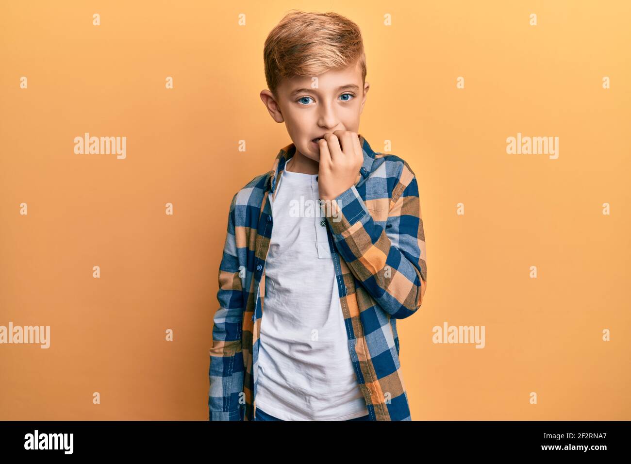 Little caucasian boy kid wearing casual clothes looking stressed and ...