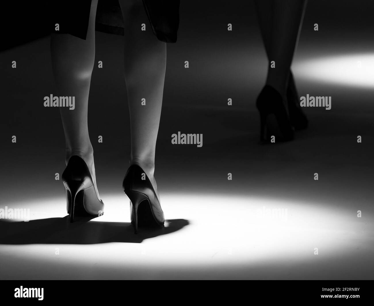 Fashion catwalk runway event, model walking the show finale. Woman legs ...