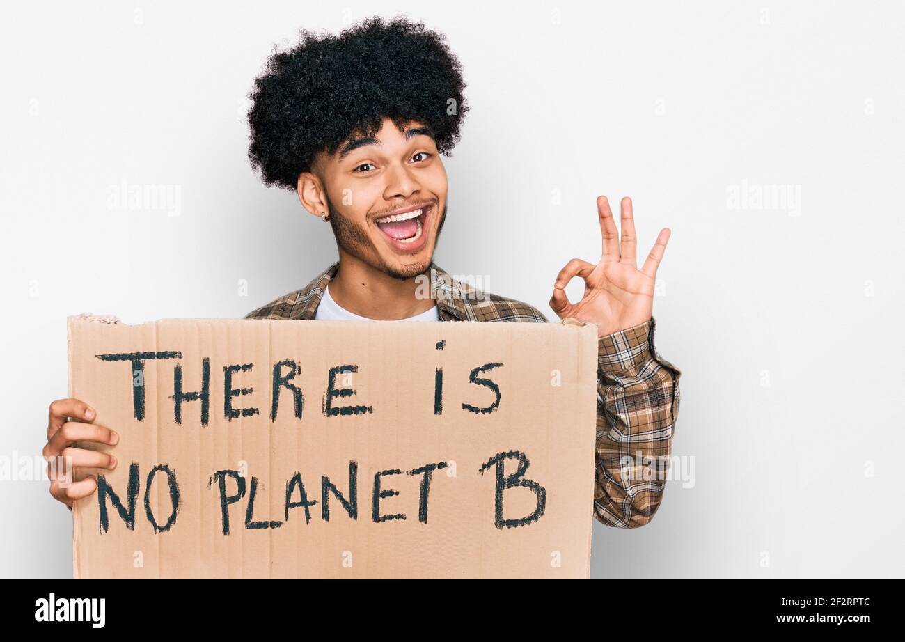 Man holding no planet banner hi-res stock photography and images - Alamy