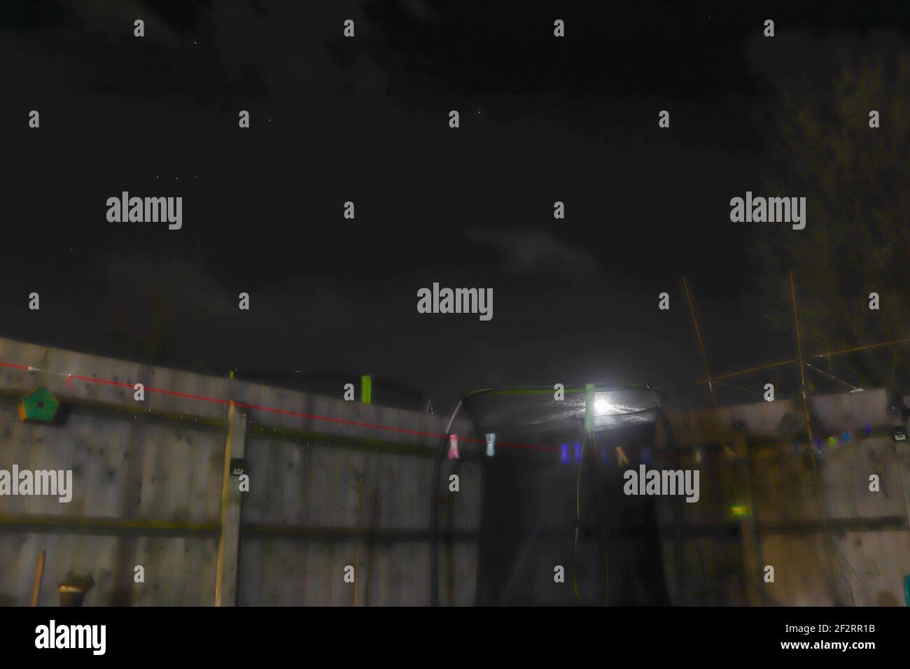 Night sky and garden lit up with halogen and solar lights Stock Photo ...