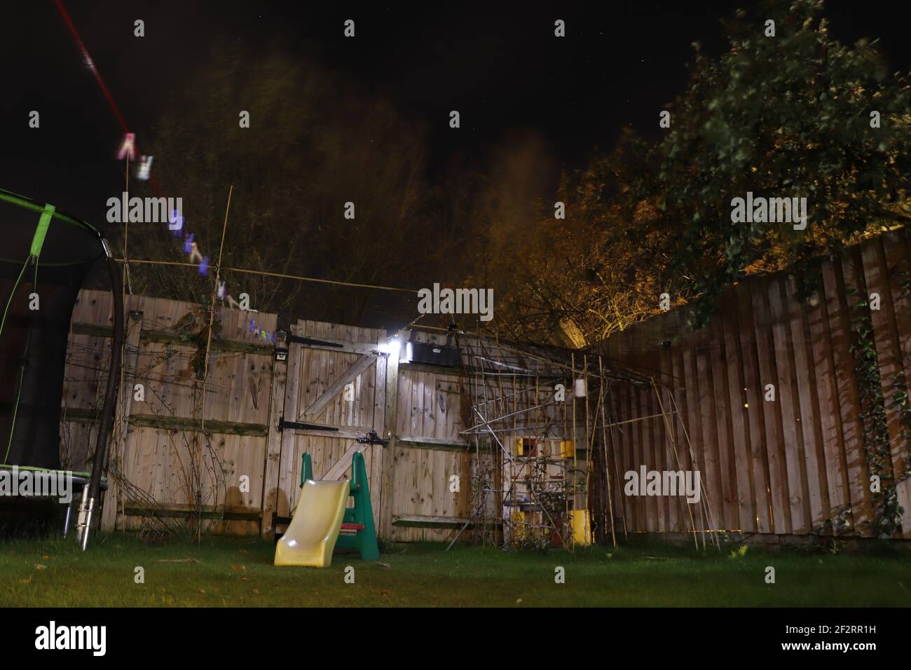 Night sky and garden lit up with halogen and solar lights Stock Photo ...