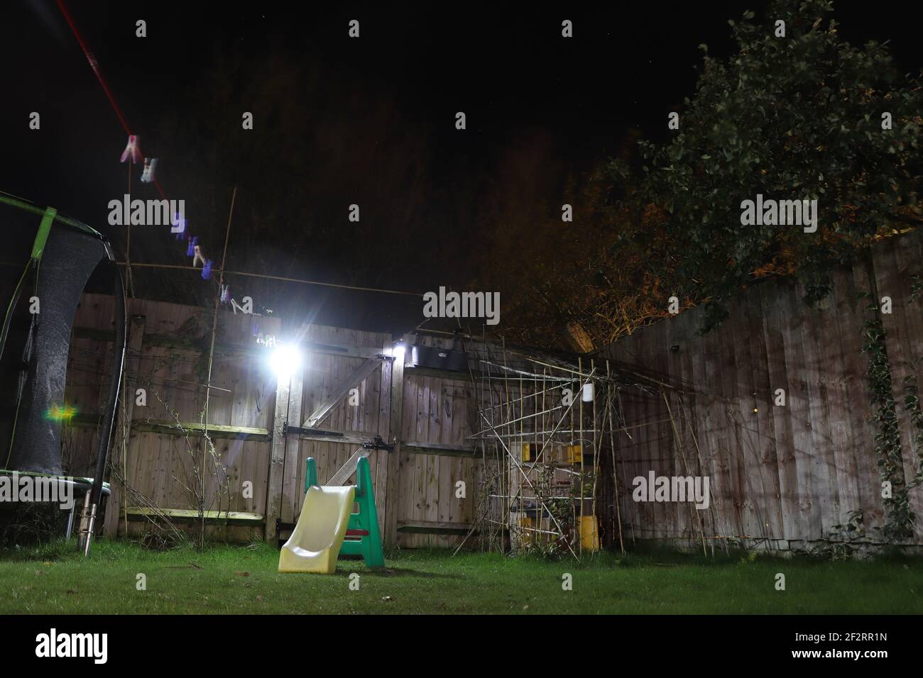 Night sky and garden lit up with halogen and solar lights Stock Photo ...