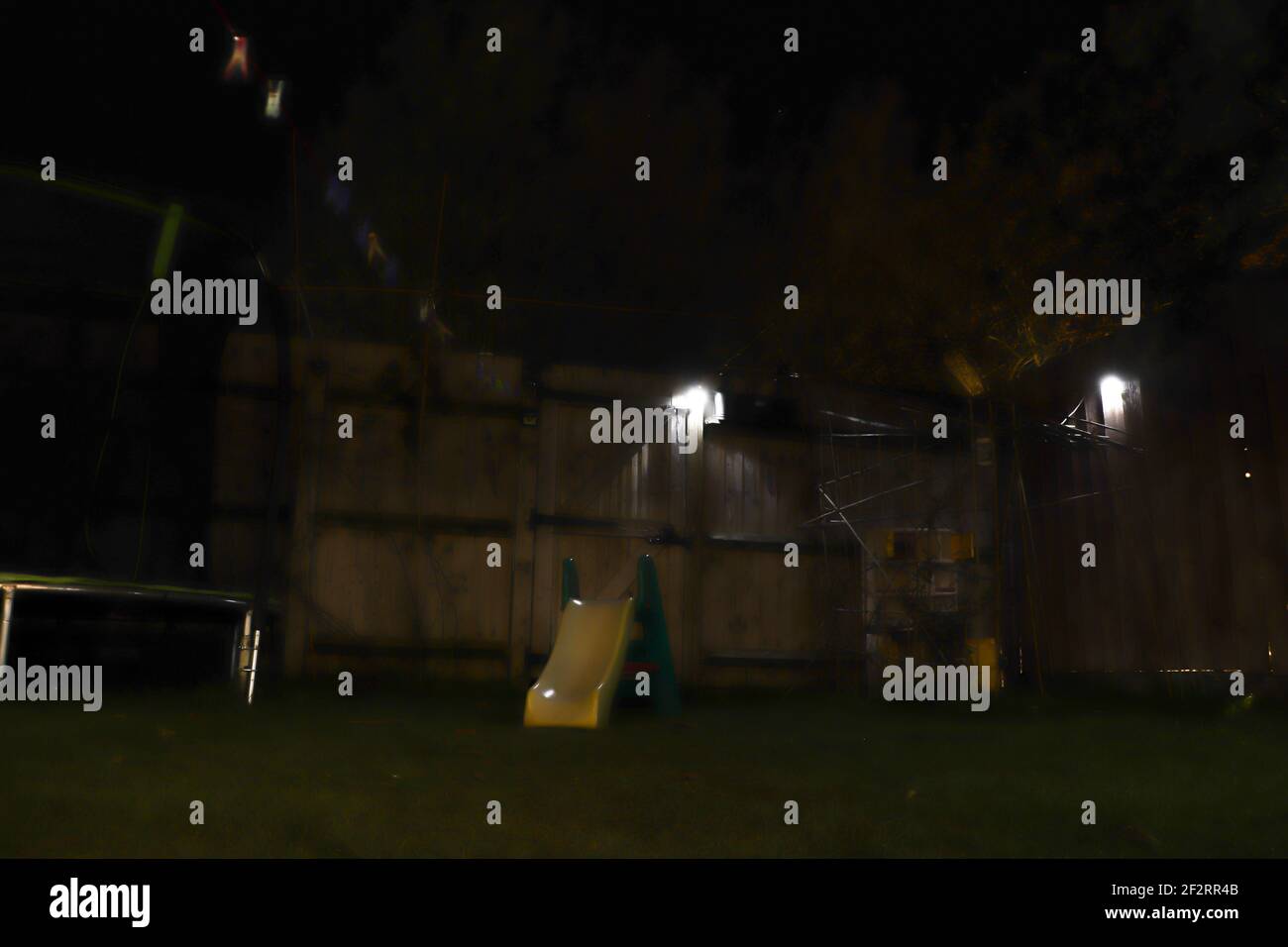 Night sky and garden lit up with halogen and solar lights Stock Photo ...