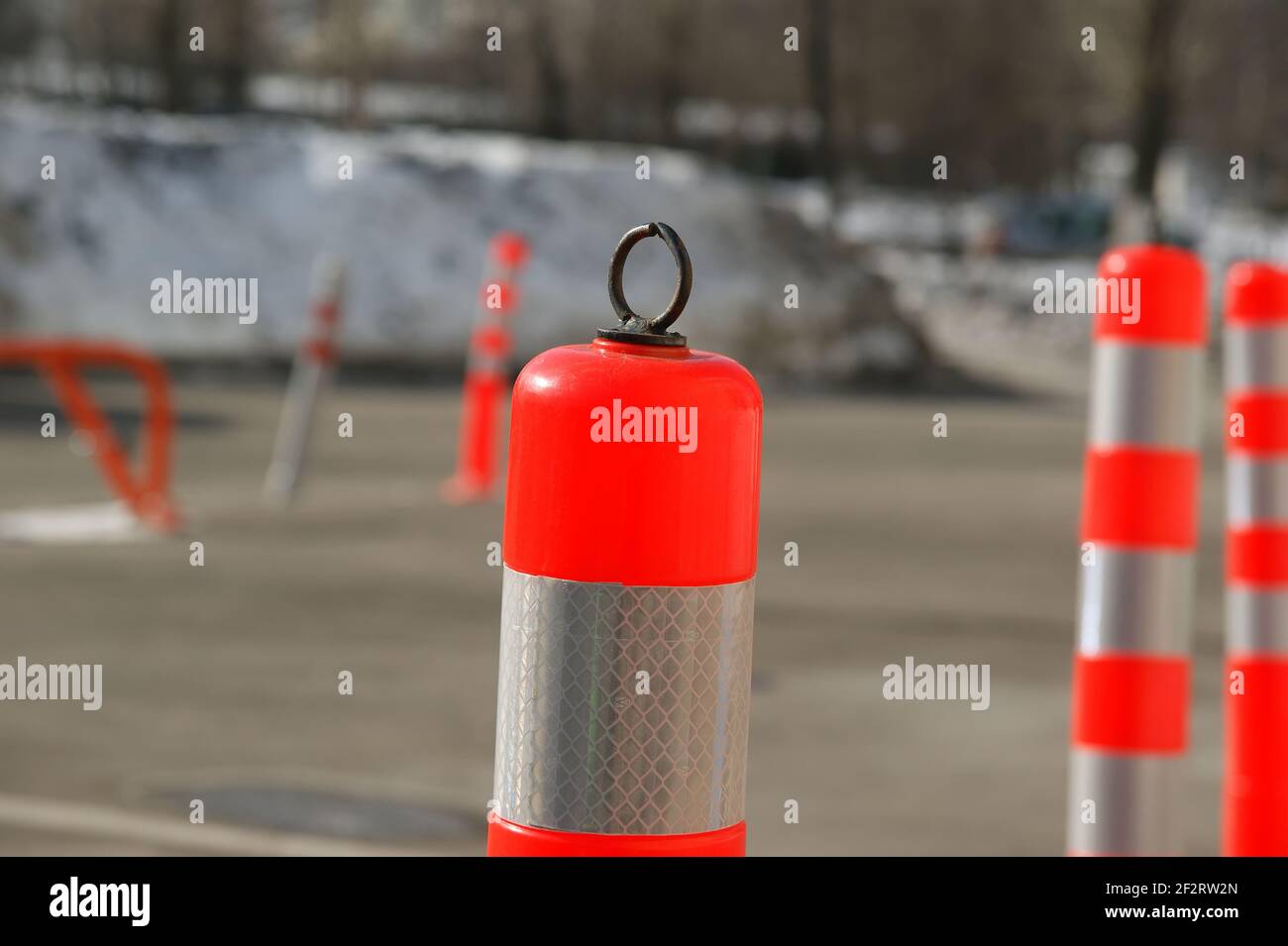 Colourful bollards in the parking lot Stock Photo - Alamy