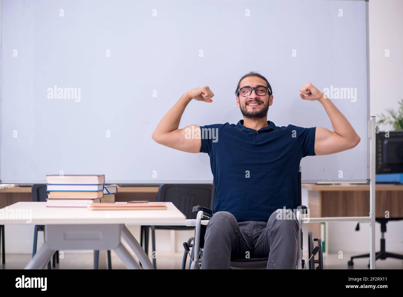 Young handicapped student in the classroom Stock Photo - Alamy