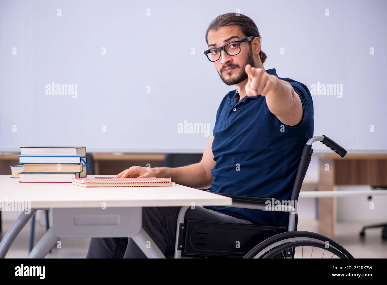 Young handicapped student in the classroom Stock Photo - Alamy