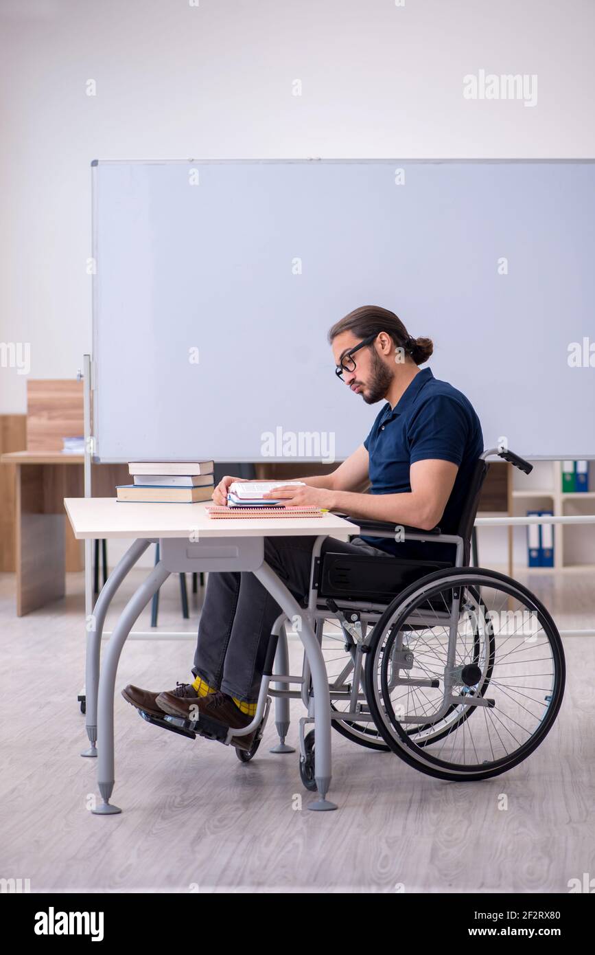 Young handicapped student in the classroom Stock Photo - Alamy