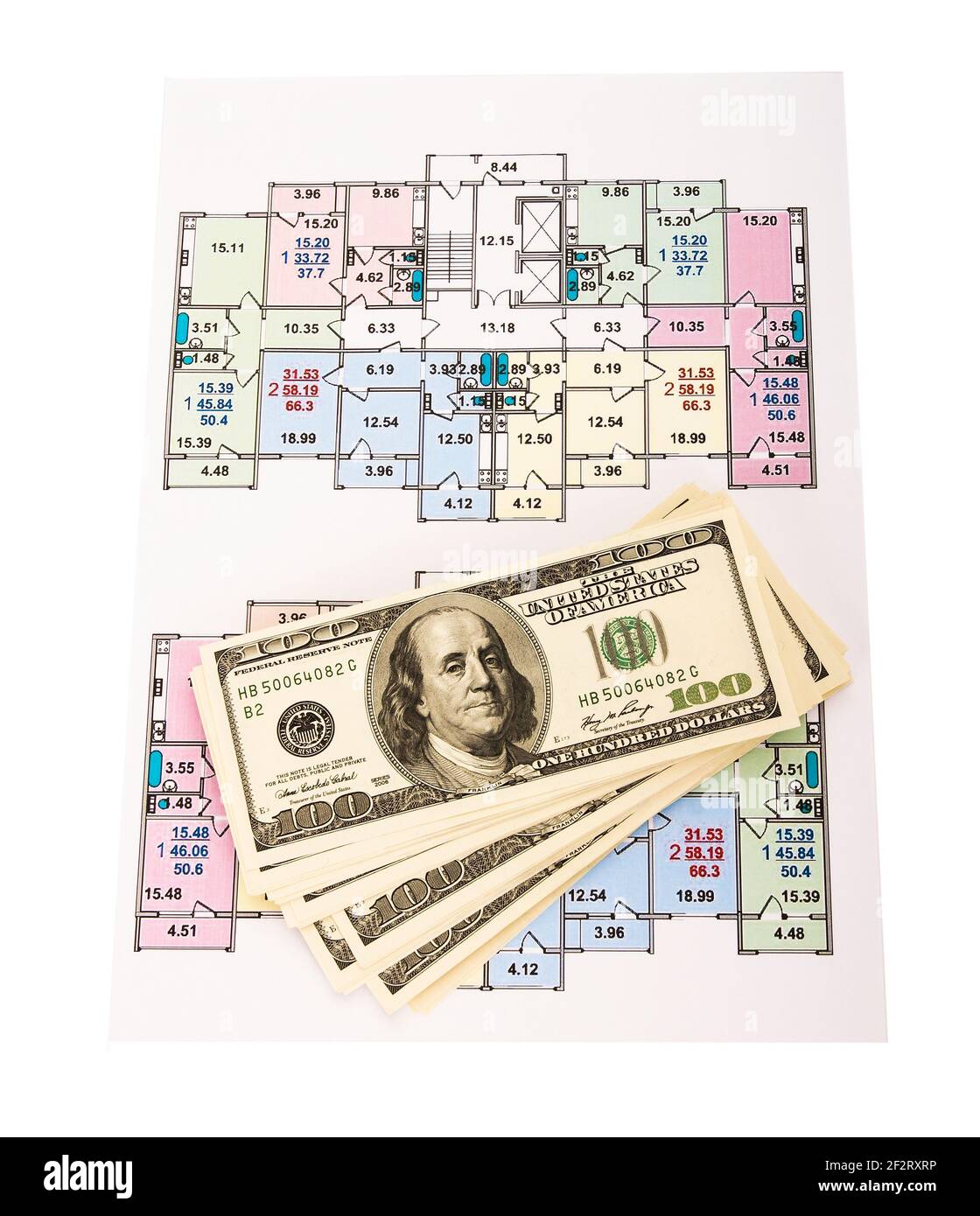 Hundred dollar bills money pile on blueprints with an architecture ...