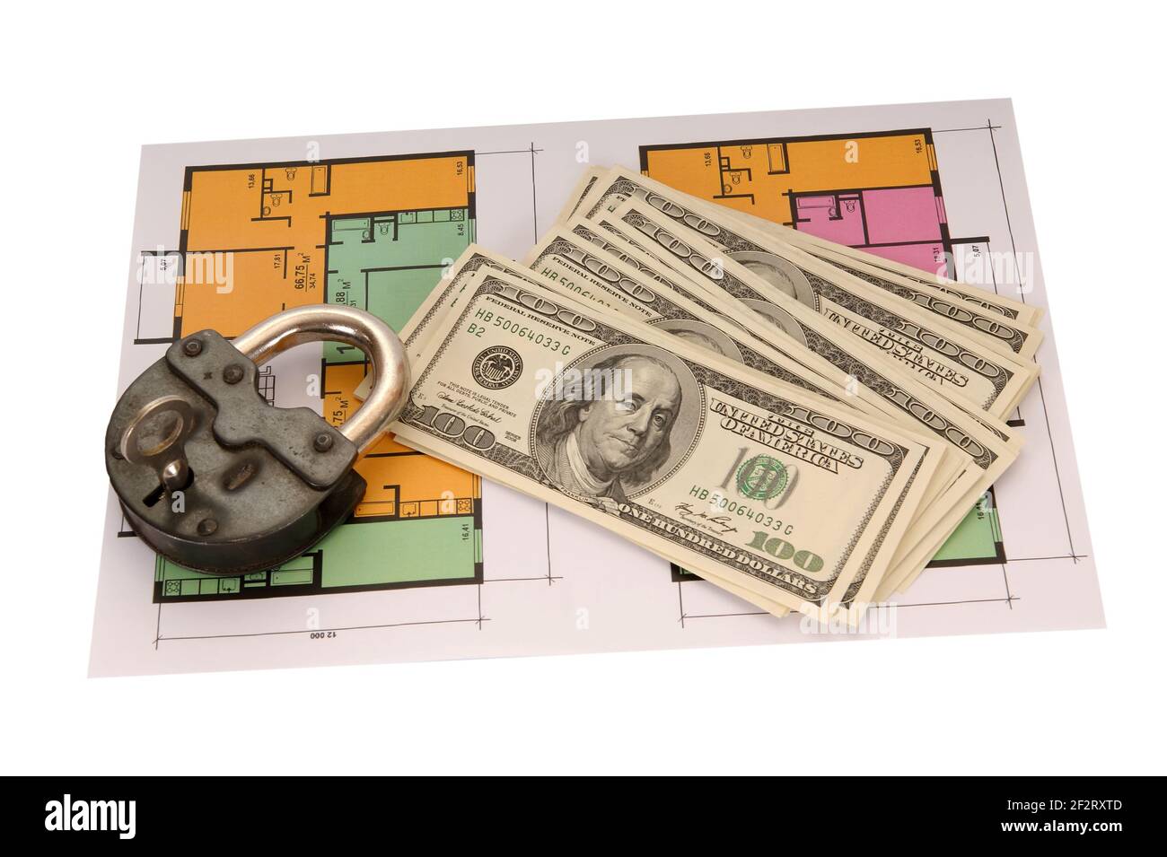 Hundred dollar bills money pile and the old castle on blueprints with ...