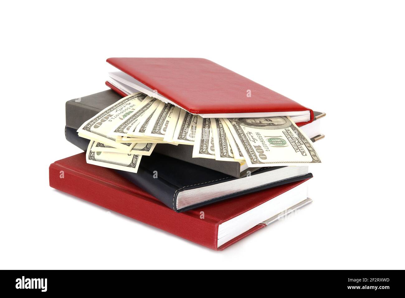 Hundred dollar bills money and a stack of notebooks Stock Photo - Alamy