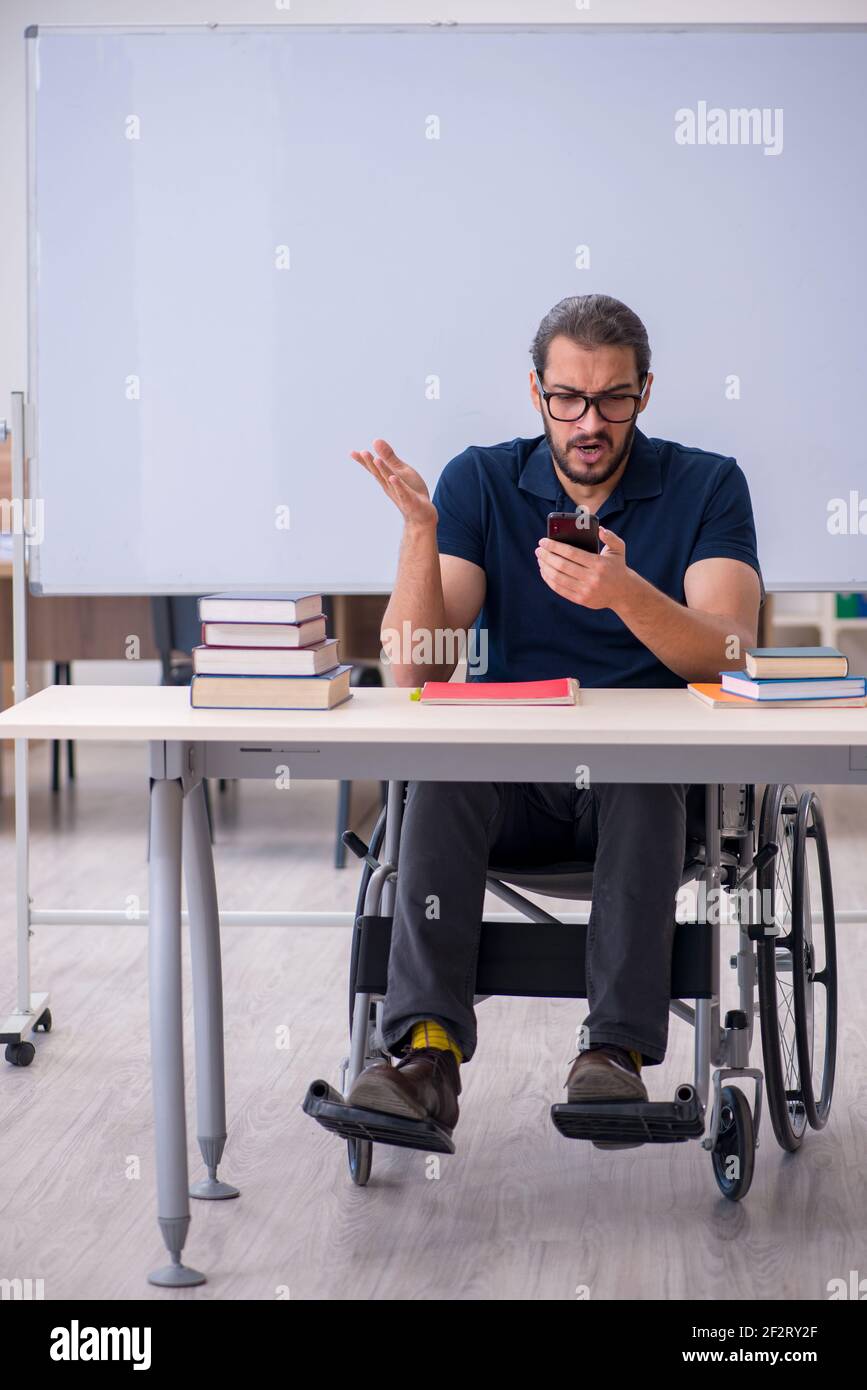 Young handicapped student in the classroom Stock Photo - Alamy