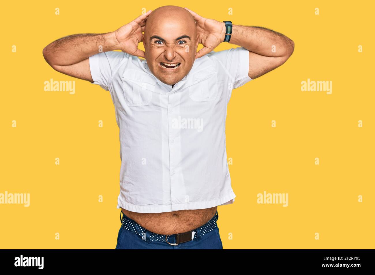 Mature middle east man with mustache wearing casual white shirt crazy ...