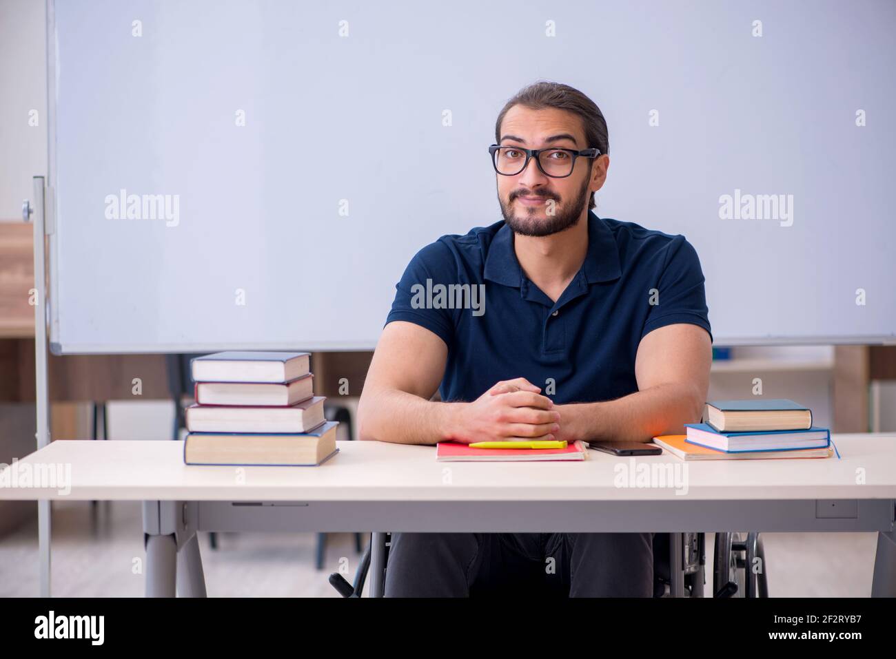 Young handicapped student in the classroom Stock Photo - Alamy