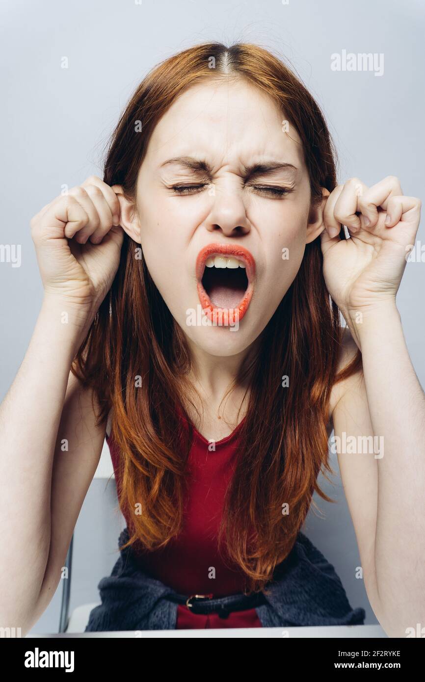 cheerful woman with wide open mouth spread her ears close-up emotions ...