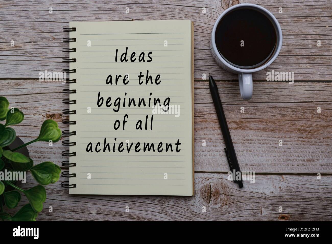 Motivational and inspirational quote on notepad on wooden desk Stock ...