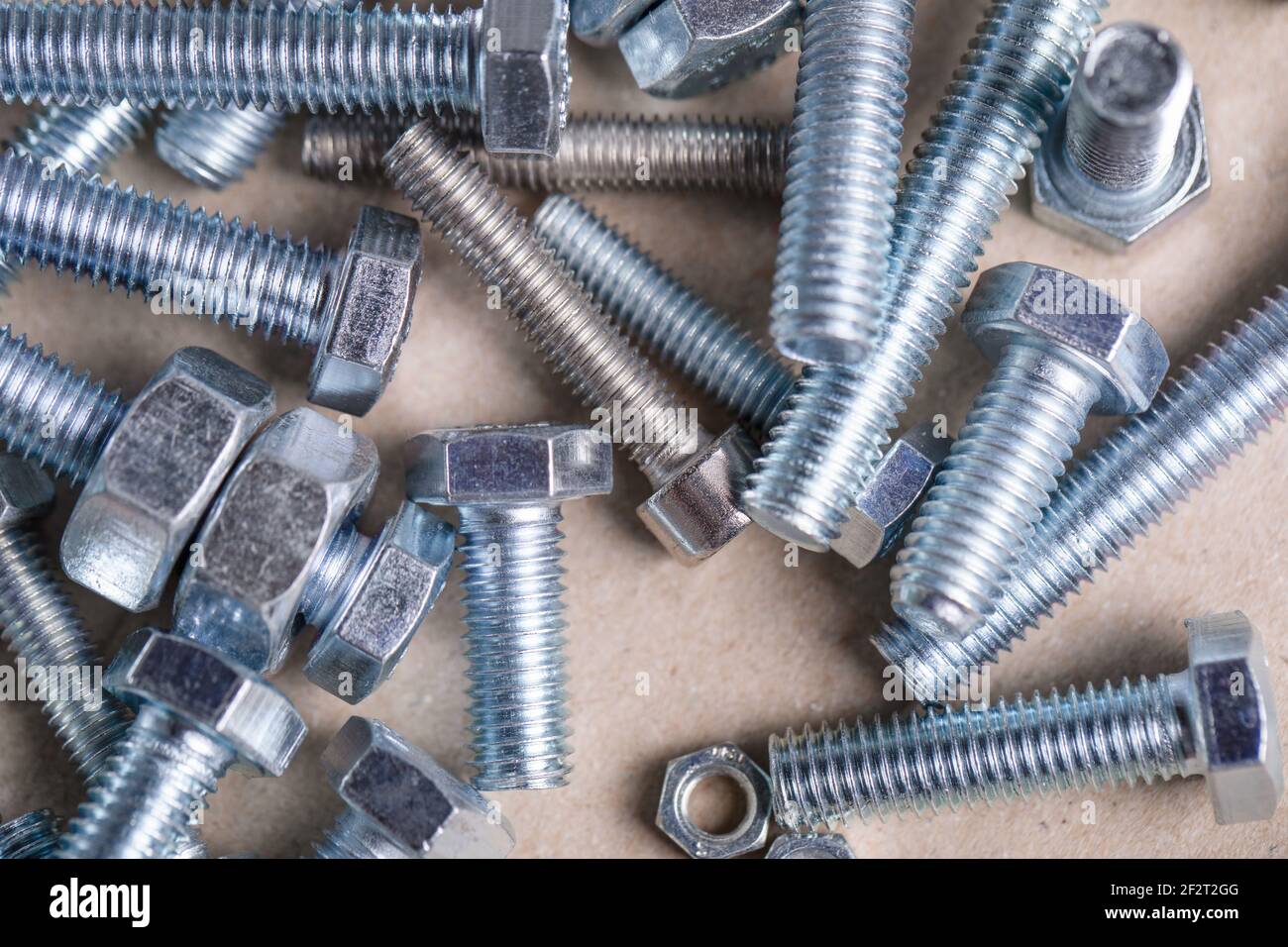 Bolts and nuts on a mirror background Stock Photo - Alamy