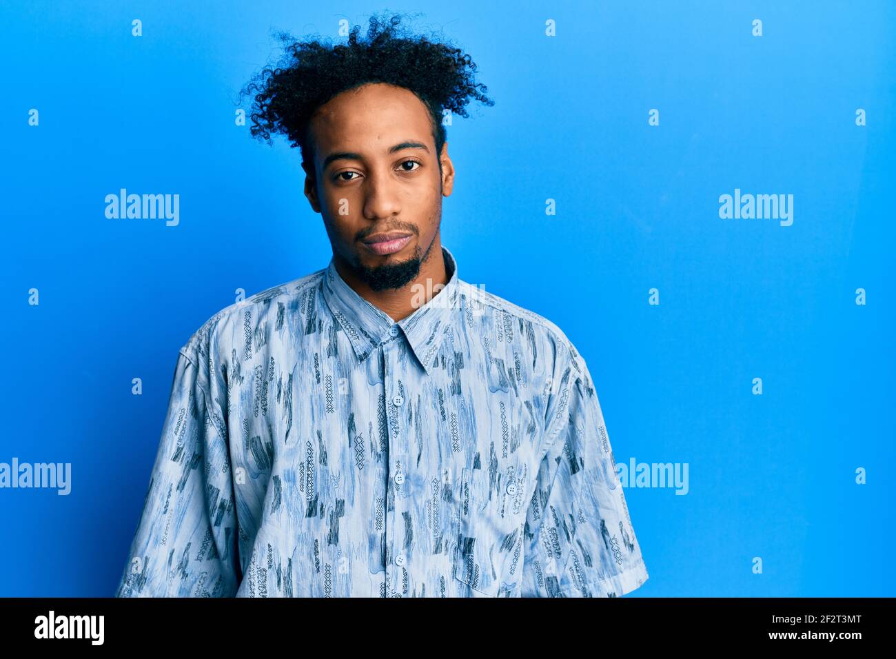 Young african american man with beard wearing casual clothes depressed ...