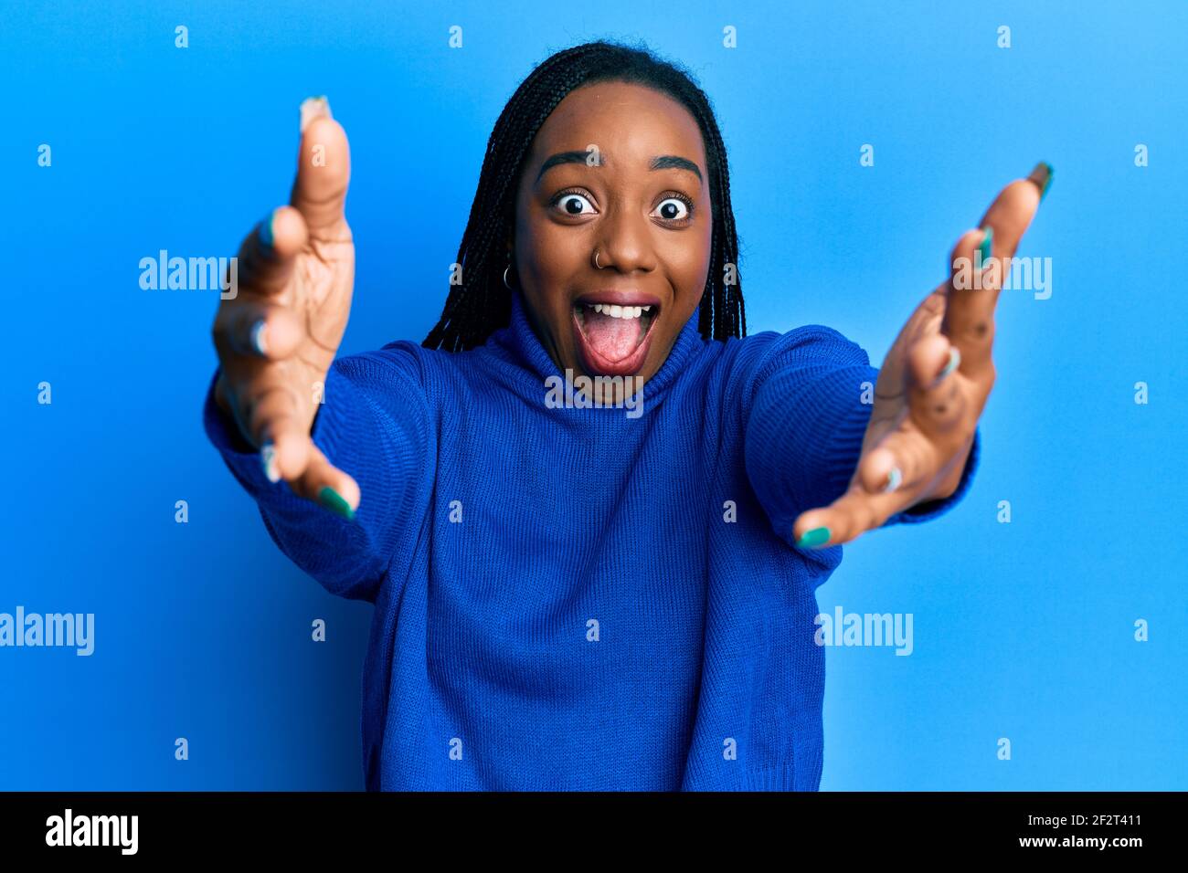Young african american woman with arms stretched hug gesture ...