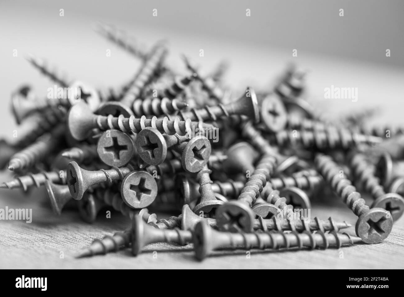 Oxidised screws, chrome-plated screws, brass-plated screws, a pile of ...