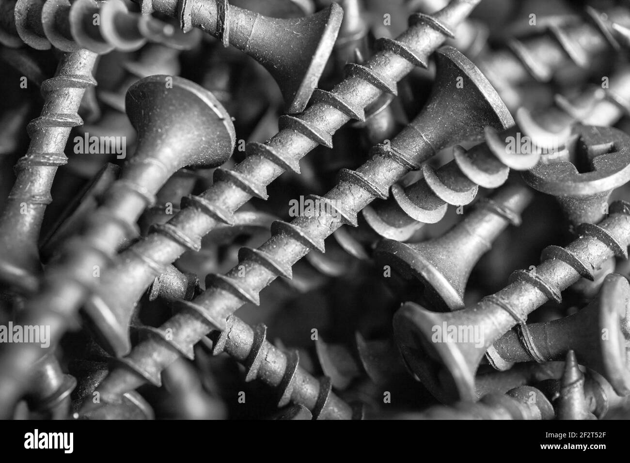 Oxidised screws, chrome-plated screws, brass-plated screws, a pile of ...
