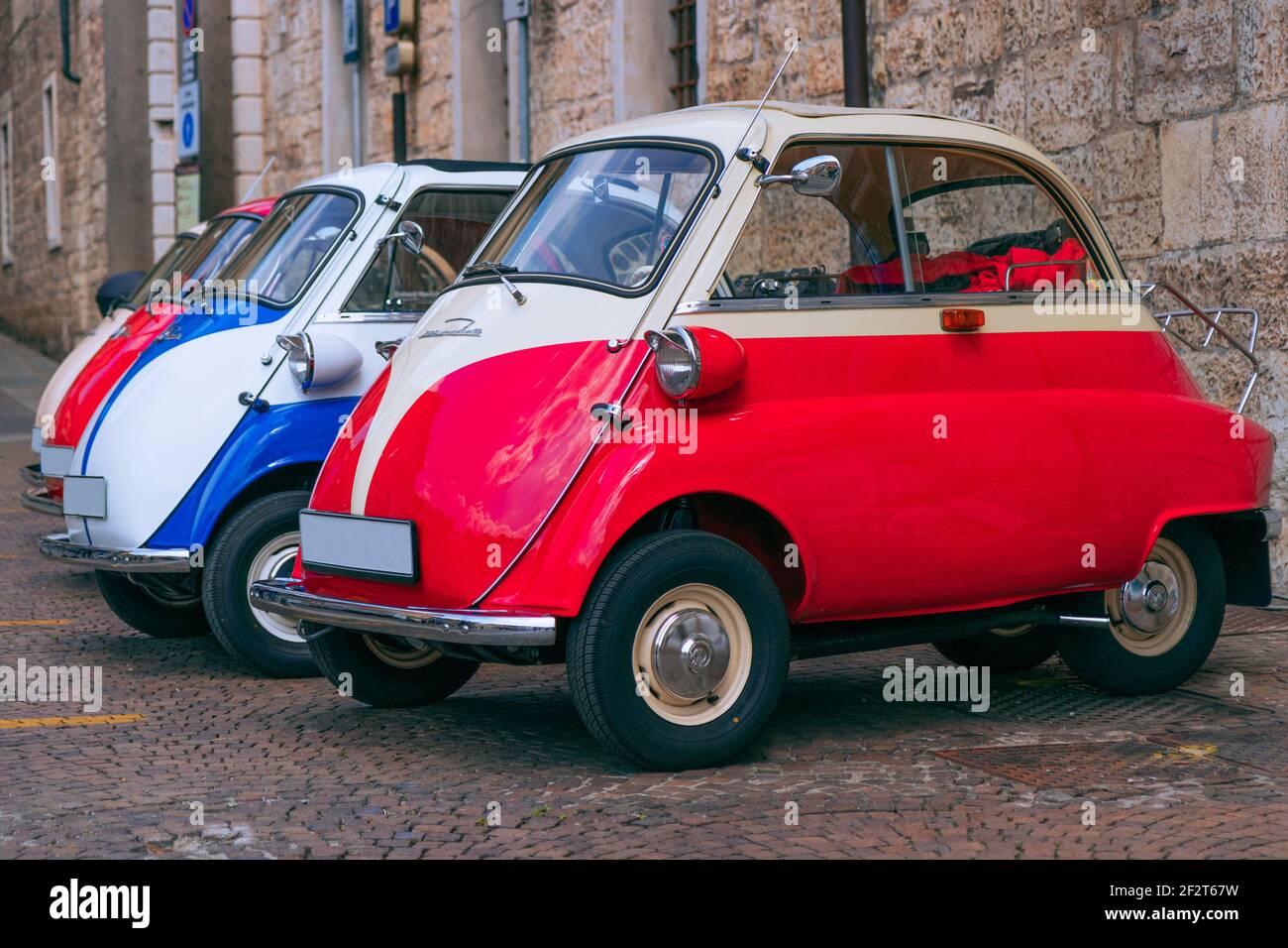 vintage small colors cars in the italian city Stock Photo - Alamy