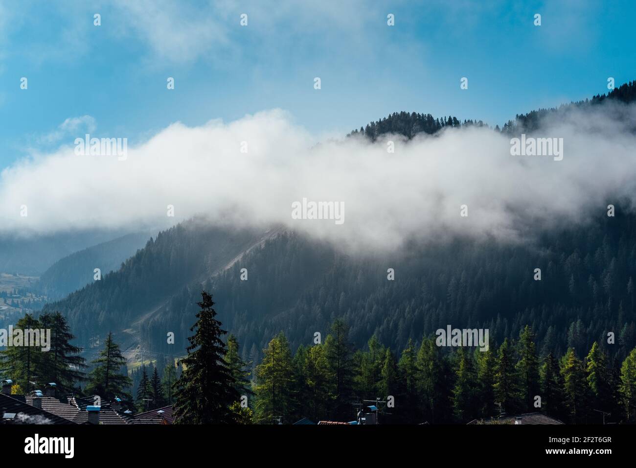 Early morning with fog in an alpine village Italian Dolomites Stock ...