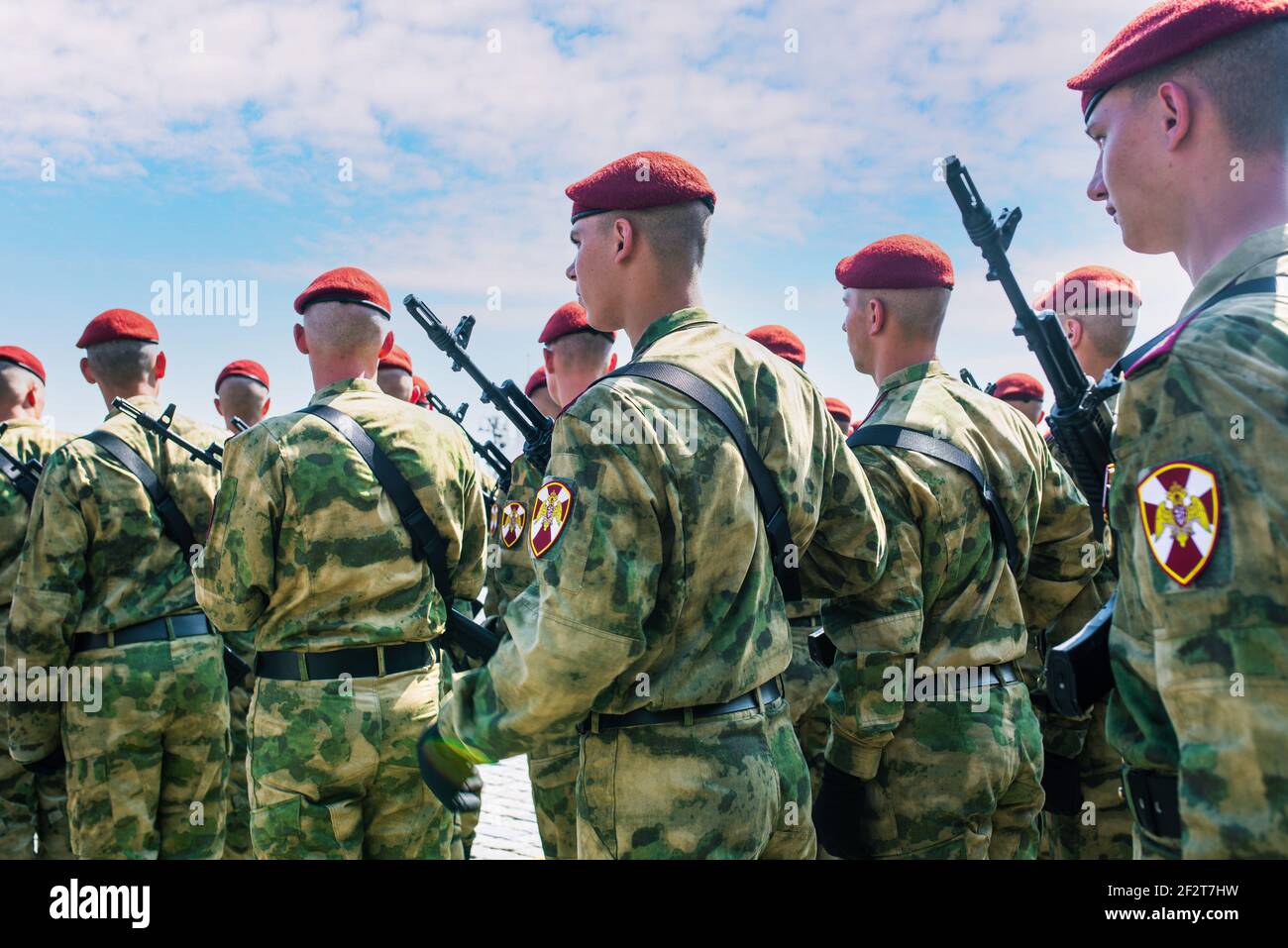 Army of soldiers with machine guns. A squad of fighters in red berets ...